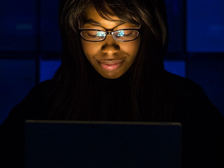 Woman’s Face Illuminated by Laptop | TIM